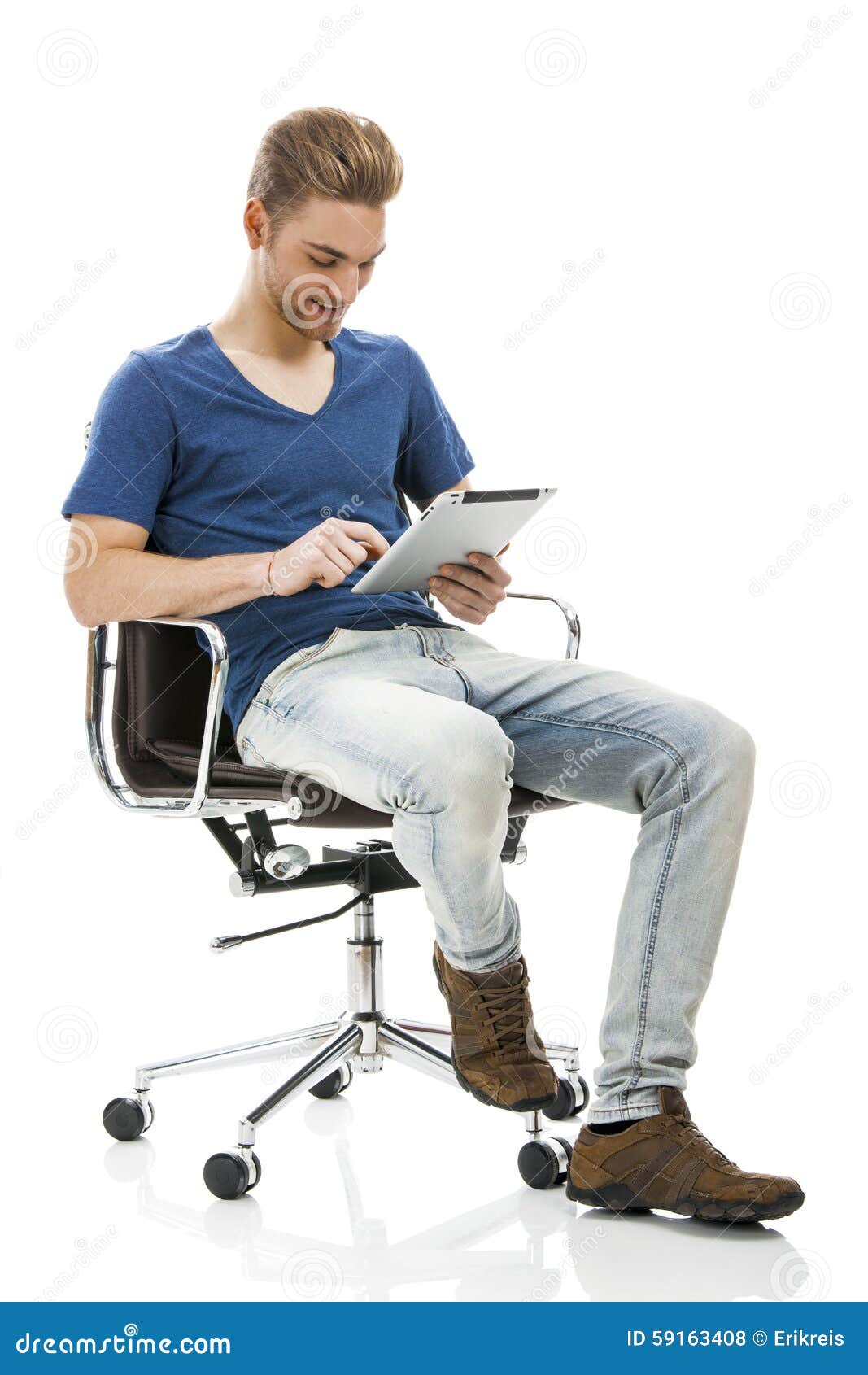 Young Man Working with a Tablet Stock Photo - Image of computer, chair ...