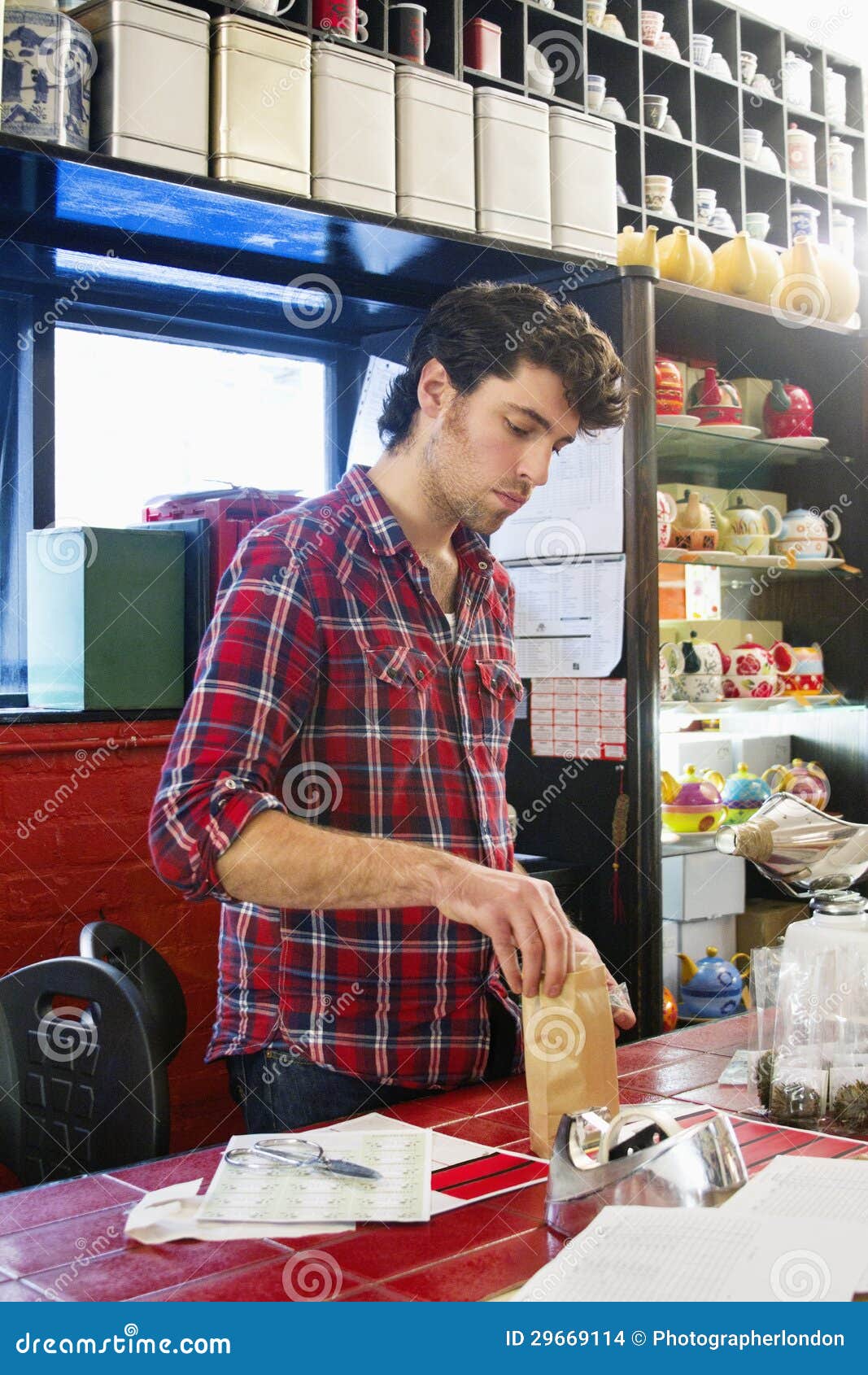 Young Man Working in Tea Shop Stock Photo - Image of clothing, working ...