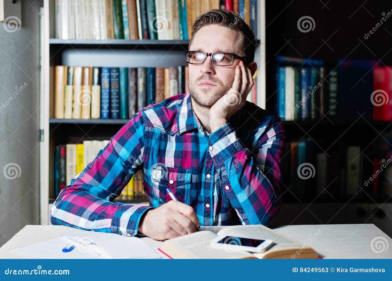 Young Man Working and Thinking in the Library Stock Image - Image of ...