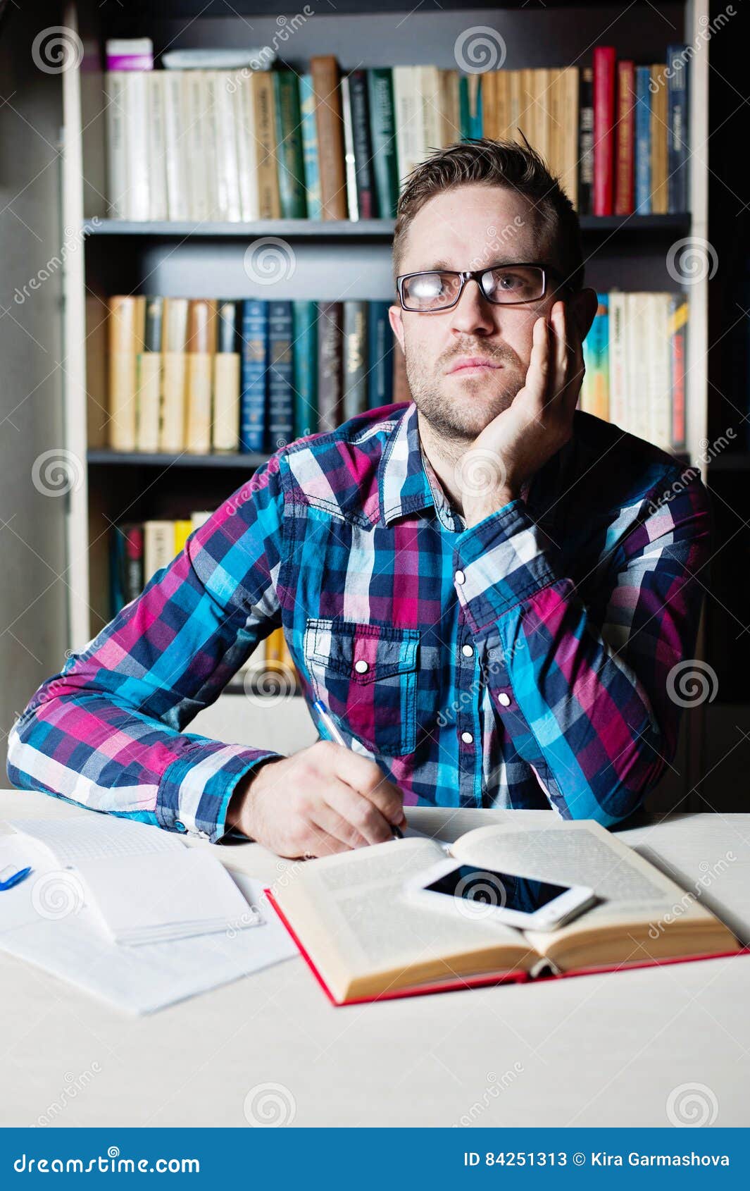 Young Man Working and Thinking in the Library Stock Image - Image of ...