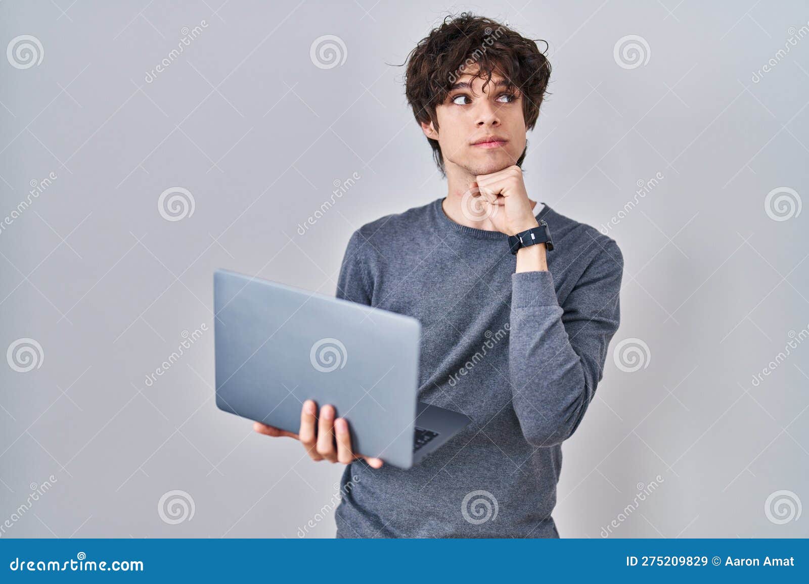 Young Man Working Using Computer Laptop Serious Face Thinking about ...
