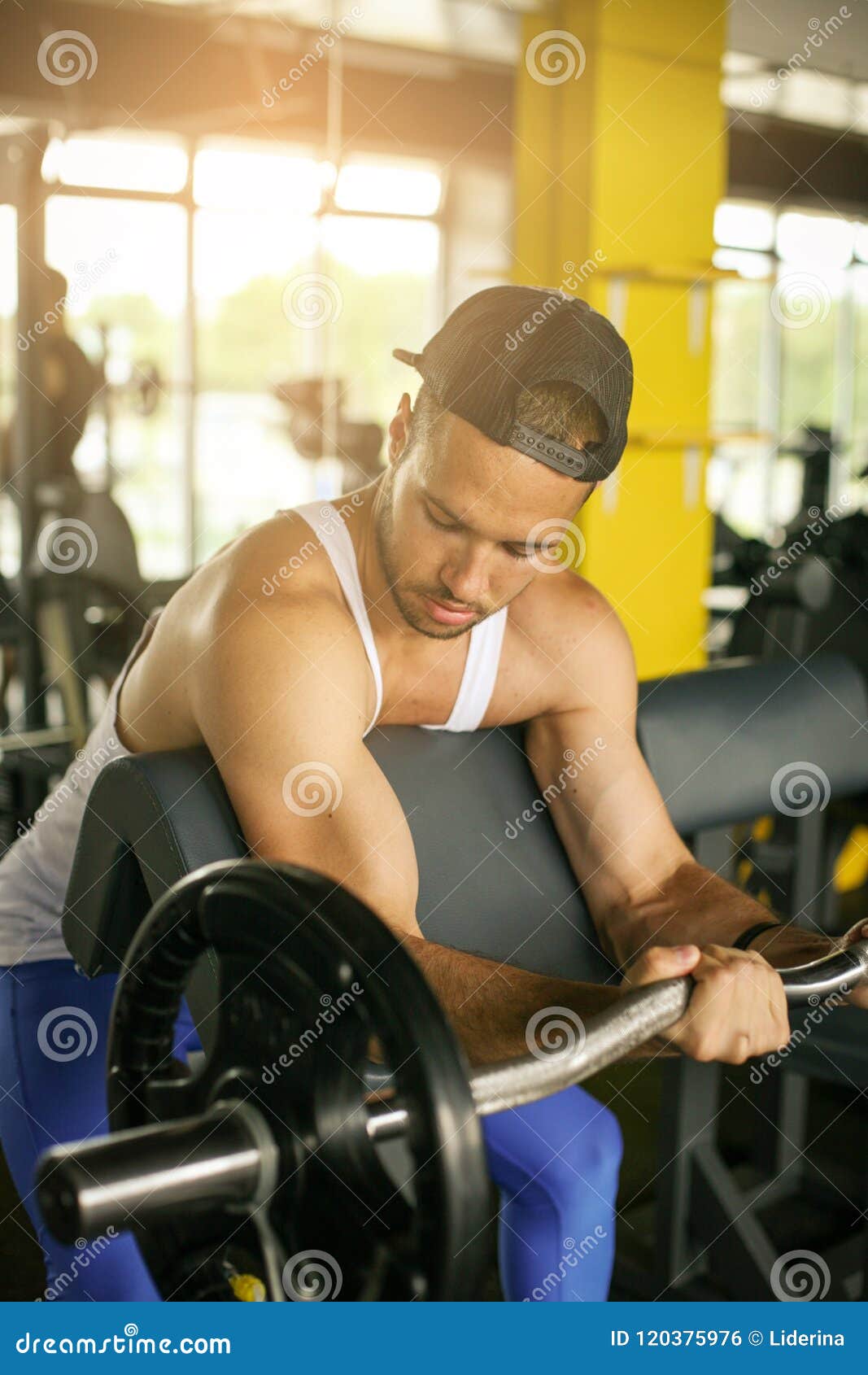 Young man workout in gym. stock photo. Image of sport - 120375976