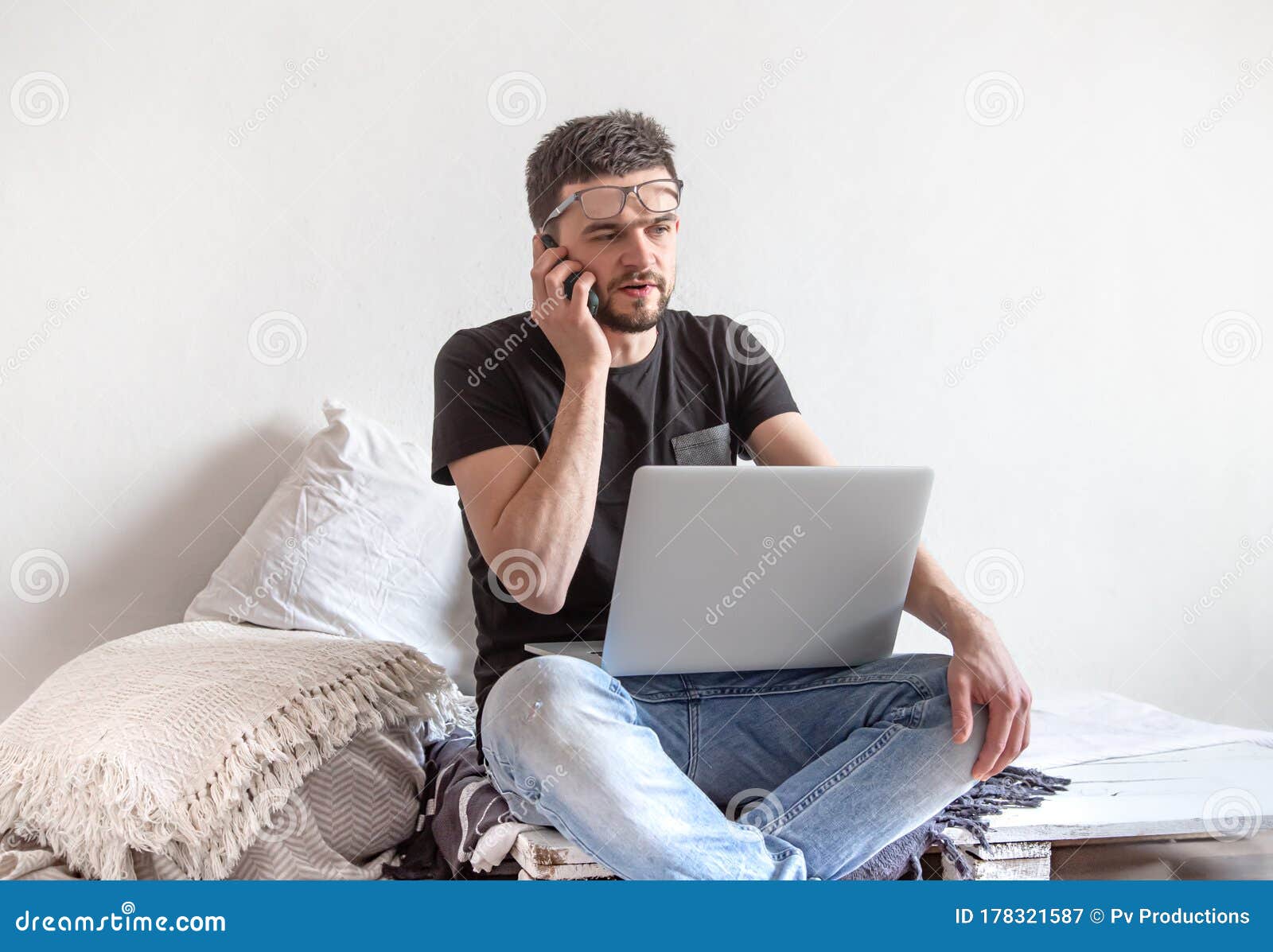 A Young Man Works Remotely at a Computer at Home Stock Image - Image of ...
