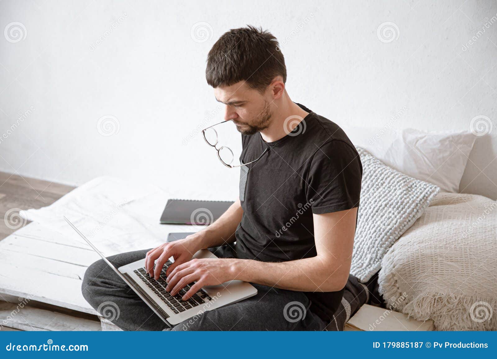 A Young Man Works Remotely at a Computer at Home Stock Image - Image of ...