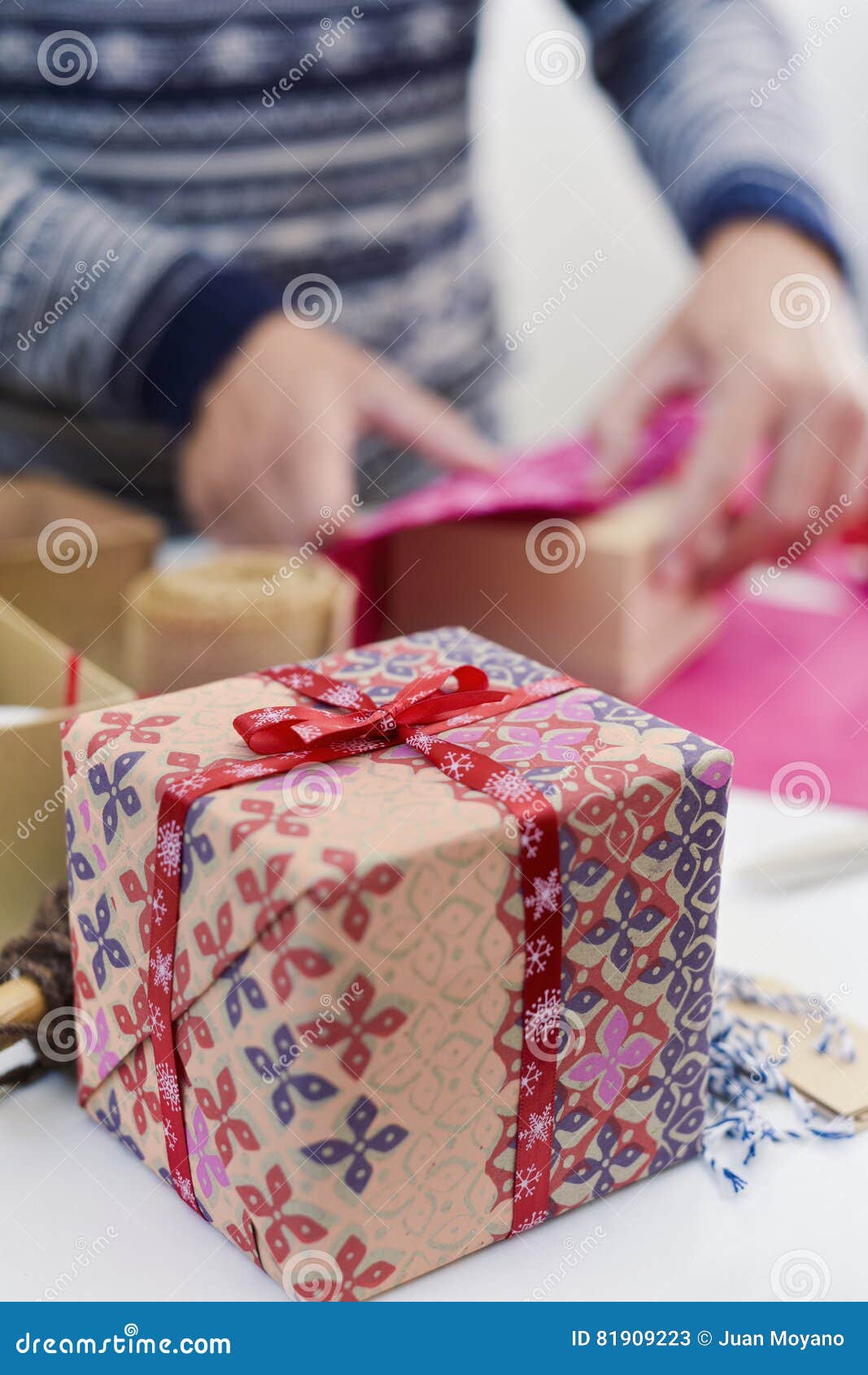 Young man wrapping a gift stock image. Image of handmade - 81909223