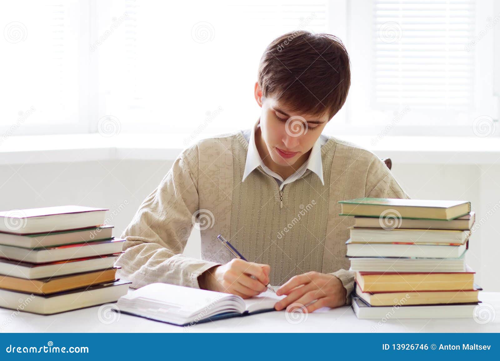 Young man writes stock photo. Image of people, dreams - 13926746