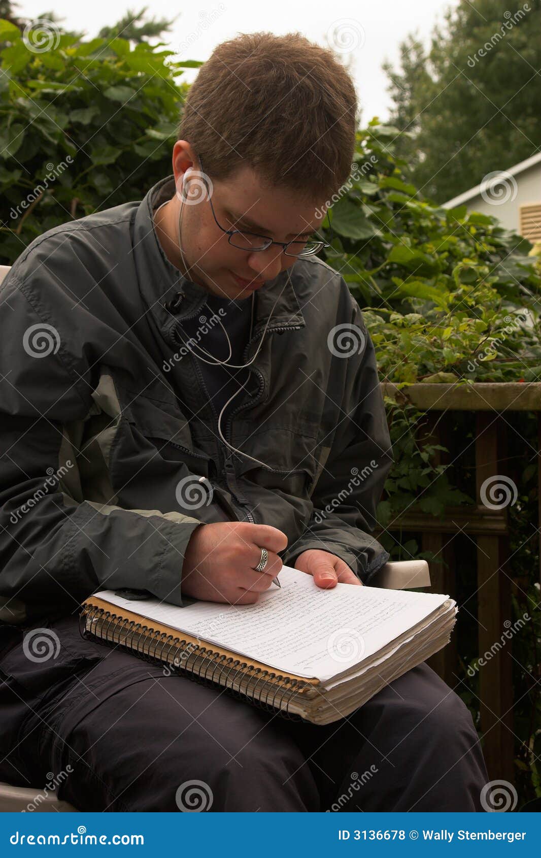 Young man writing stock photo. Image of fingers, paper - 3136678