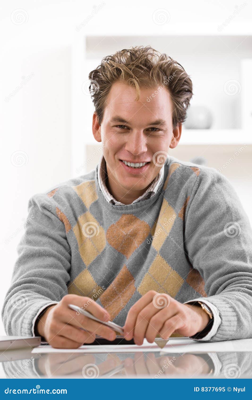 Young man writing at desk stock image. Image of caucasian - 8377695