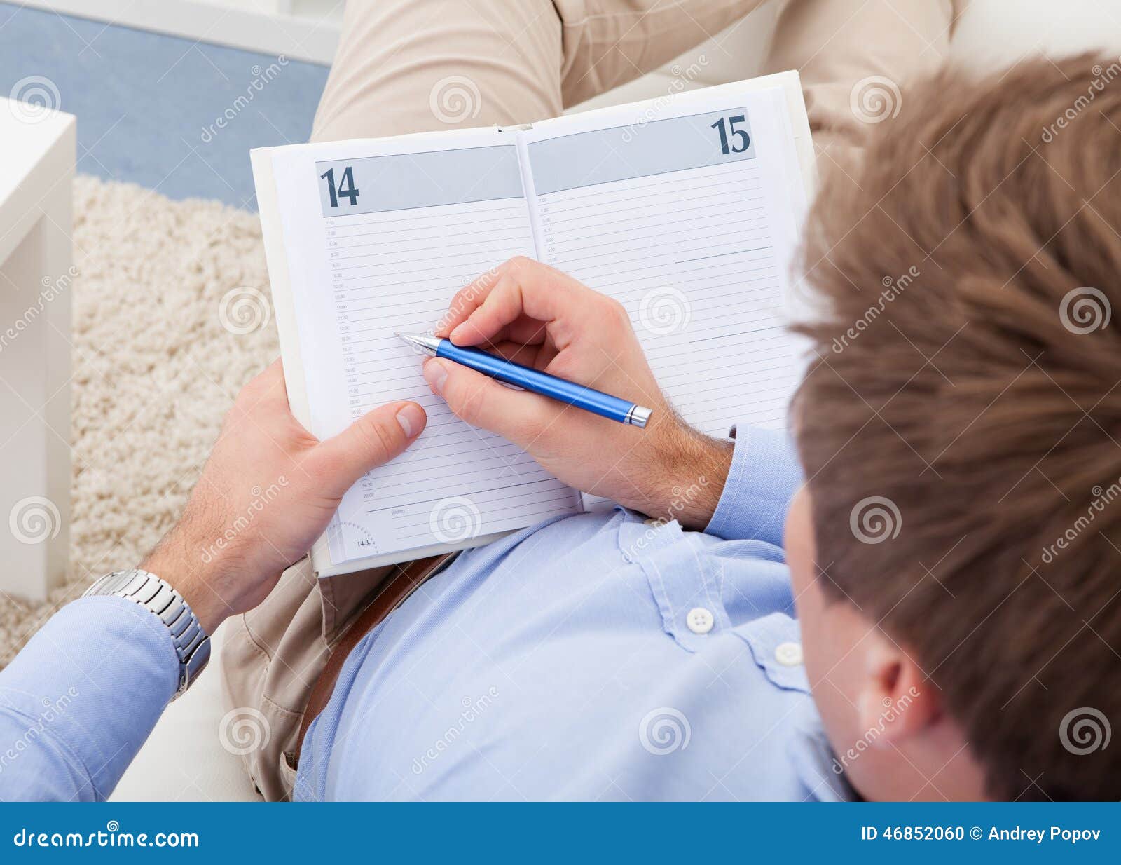 Young man writing in diary stock photo. Image of inside - 46852060
