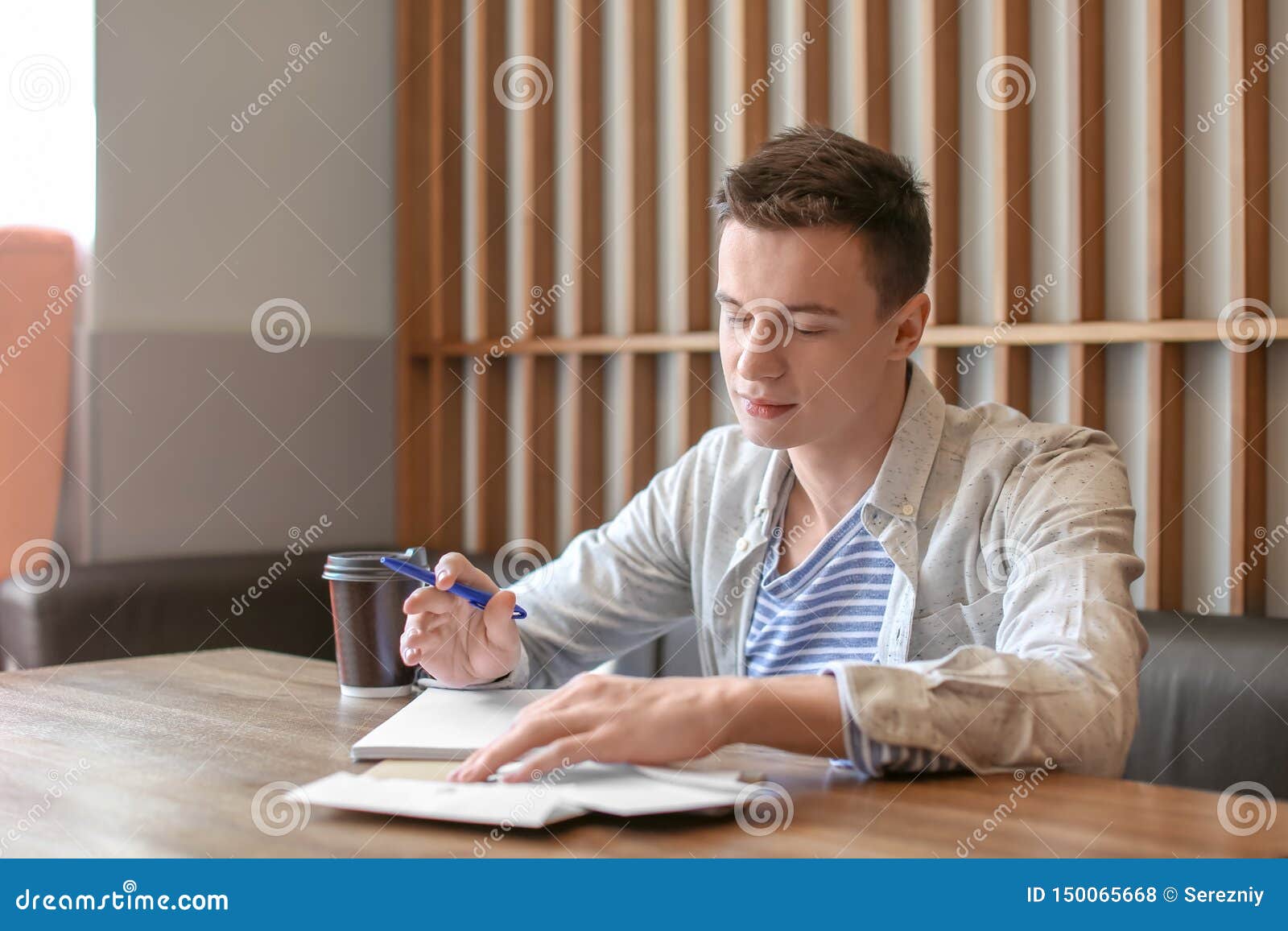 Young Man Writing Letter at Table in Cafe. Mail Delivery Stock Photo ...