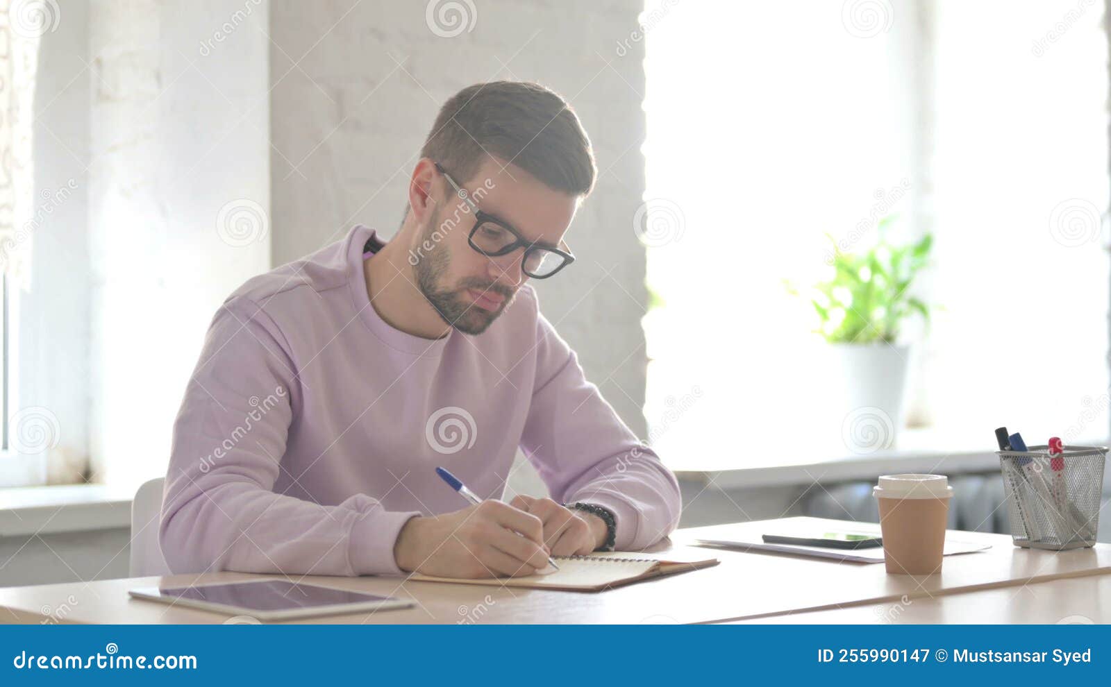 Young Man Writing on Paper in Office Stock Video - Video of signature ...