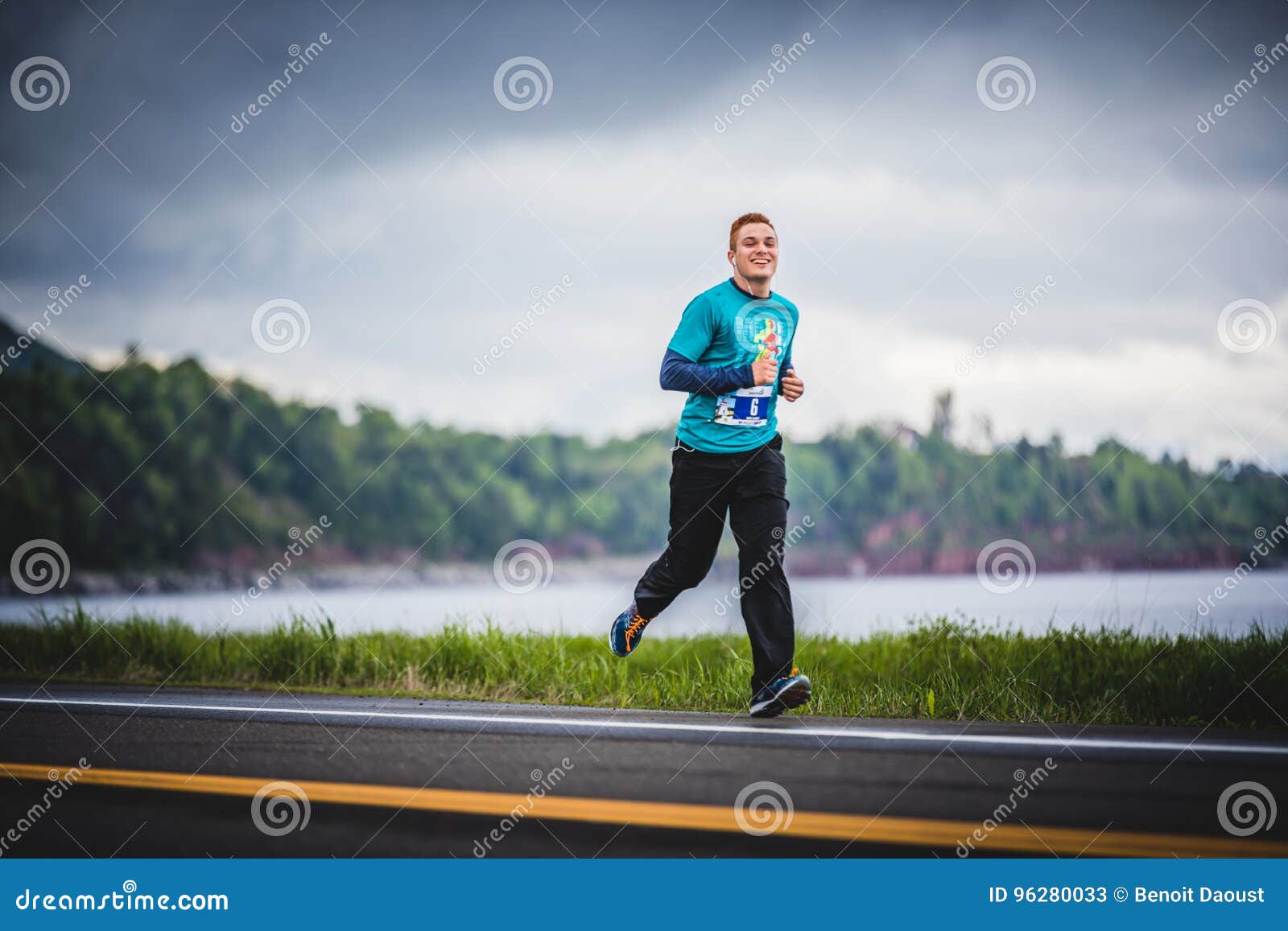 Young Marathoner Alone on the Side of the Road and Ocean Editorial ...