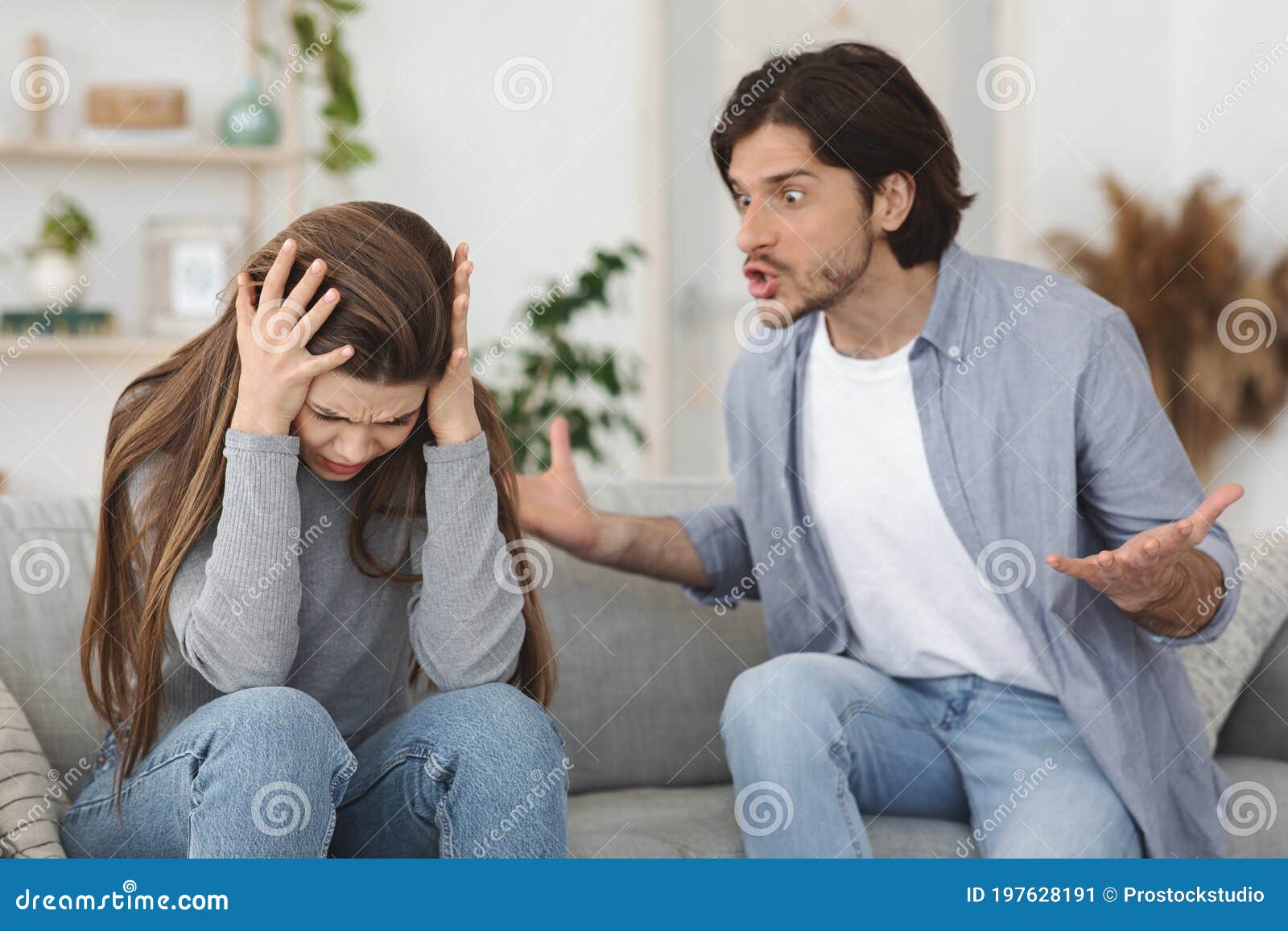 Young Married Couple Fighting Yelling At Each Other At Home Stock