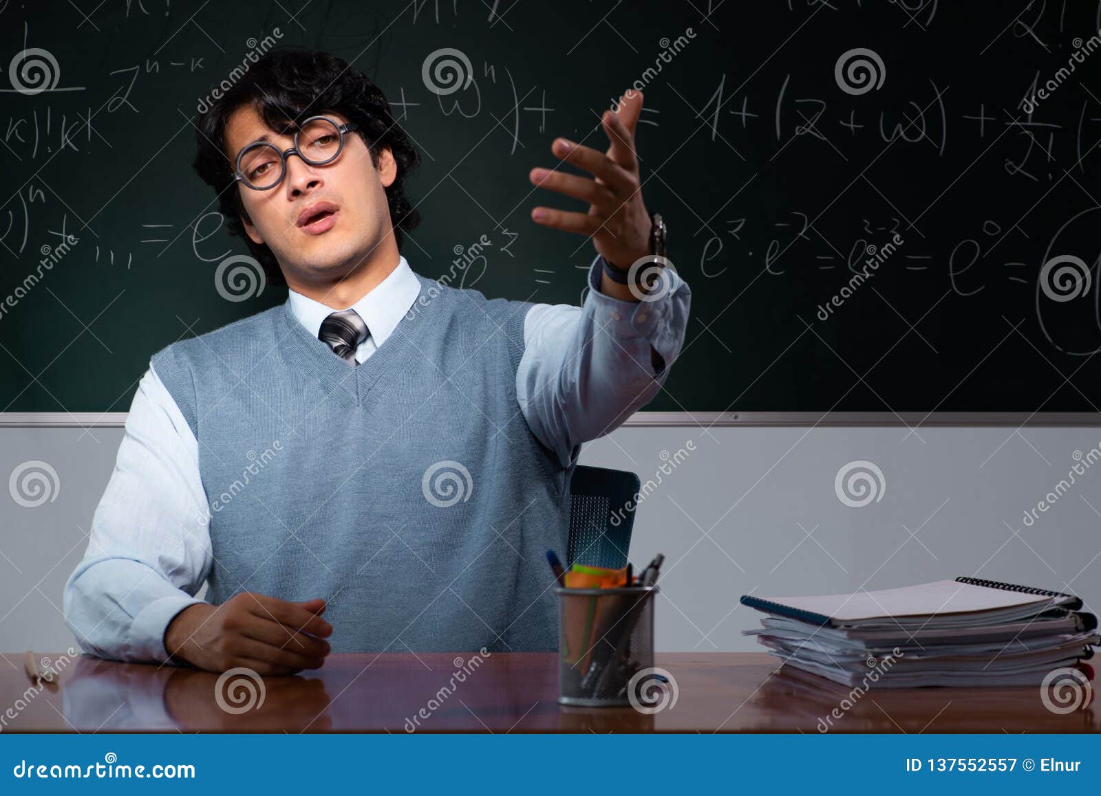 The Young Math Teacher in Front of Chalkboard Stock Image - Image of ...