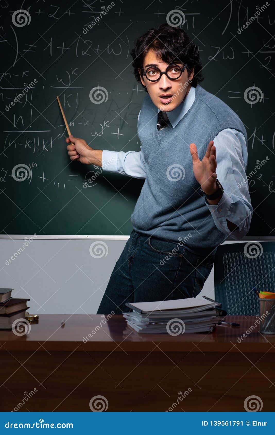 The Young Math Teacher in Front of Chalkboard Stock Image - Image of ...
