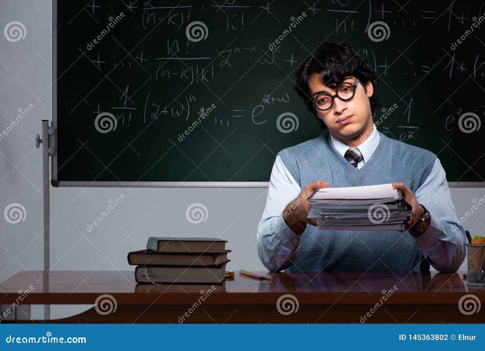 The Young Math Teacher in Front of Chalkboard Stock Photo - Image of ...