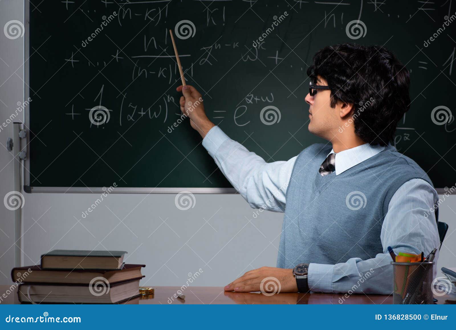 The Young Math Teacher in Front of Chalkboard Stock Photo - Image of ...
