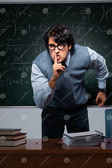 The Young Math Teacher in Front of Chalkboard Stock Image - Image of ...