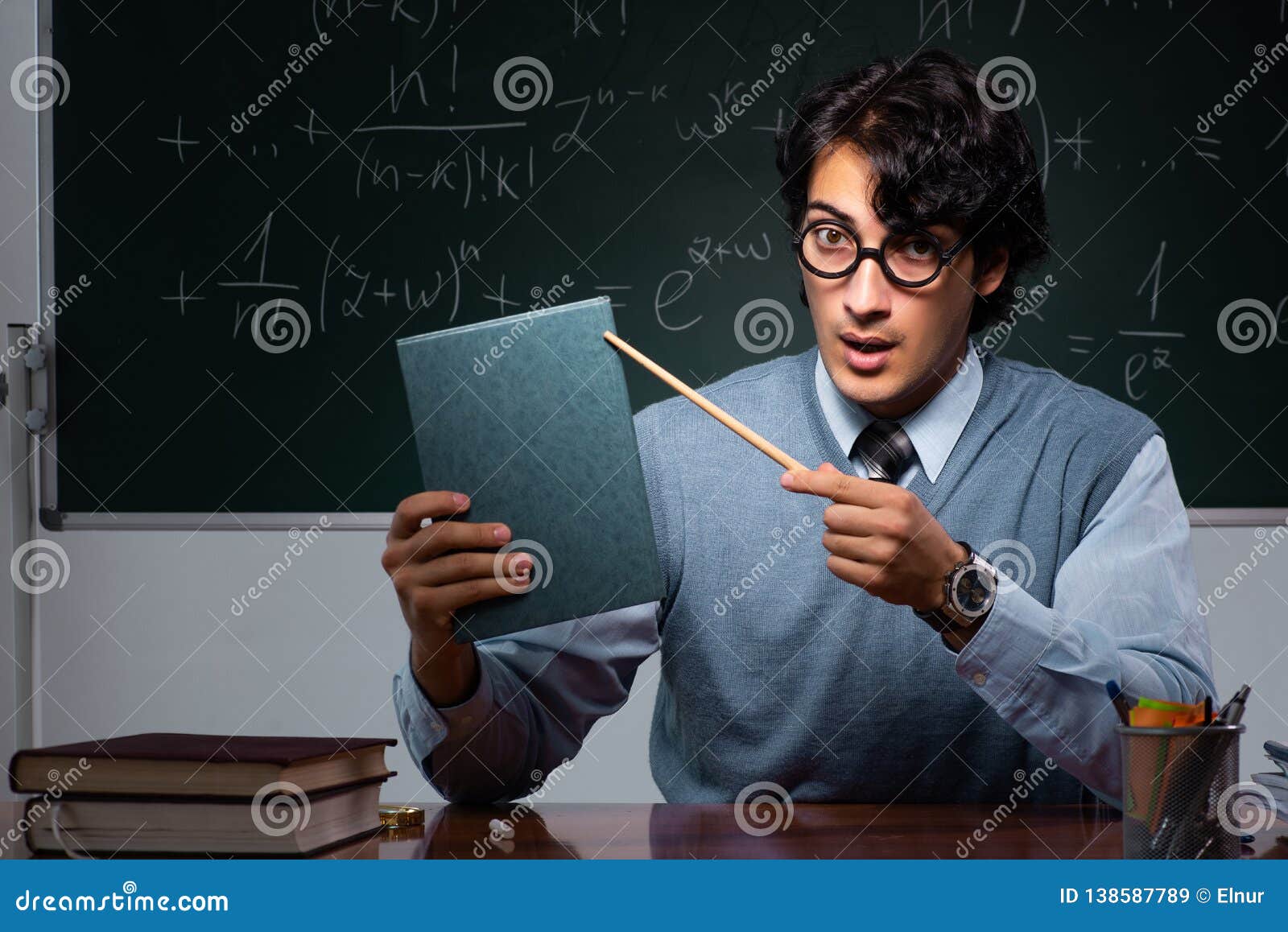 The Young Math Teacher in Front of Chalkboard Stock Image - Image of ...