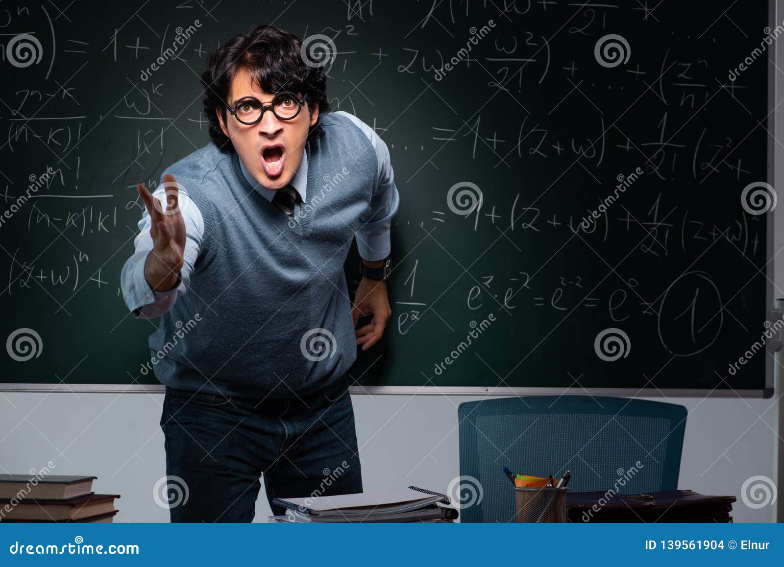 The Young Math Teacher in Front of Chalkboard Stock Photo - Image of ...