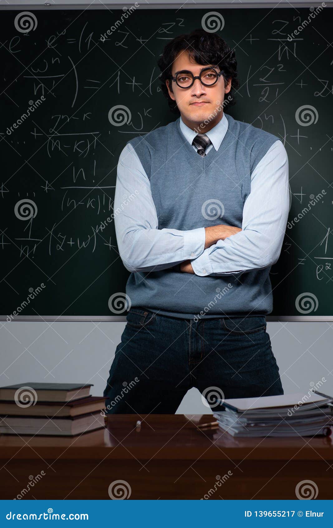 The Young Math Teacher in Front of Chalkboard Stock Image - Image of ...