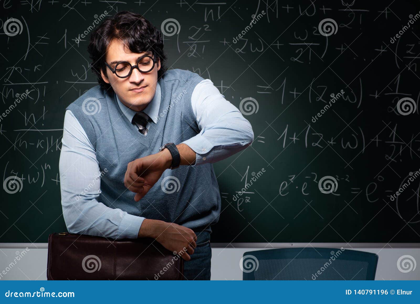 The Young Math Teacher in Front of Chalkboard Stock Photo - Image of ...