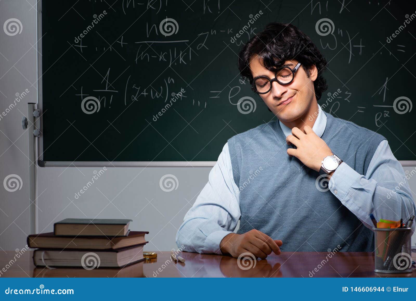 The Young Math Teacher in Front of Chalkboard Stock Photo - Image of ...
