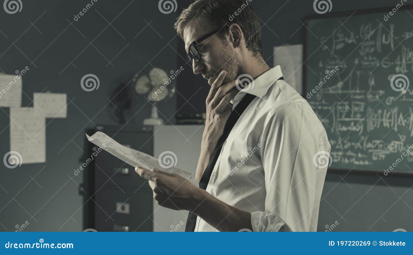 Young Mathematician Studying in His Office and Reading Papers Stock ...