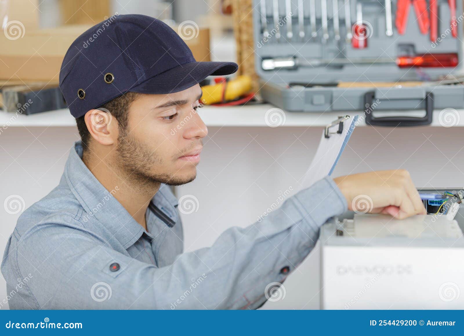 Young Mechanic Apprentice Working Fixing Machine Stock Photo - Image of ...