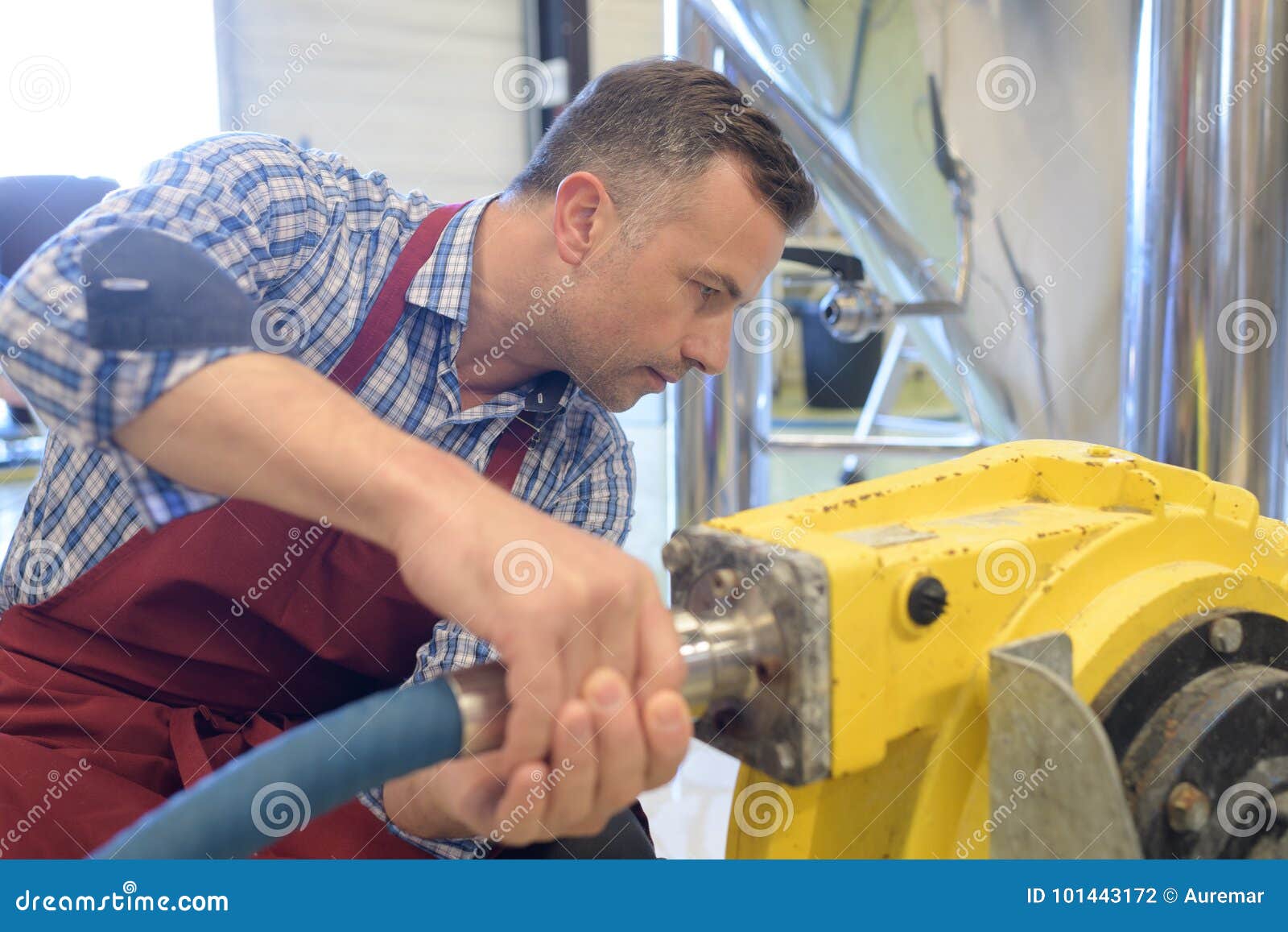 Young Mechanic Fixing Plow on Tractor Stock Photo - Image of protective ...