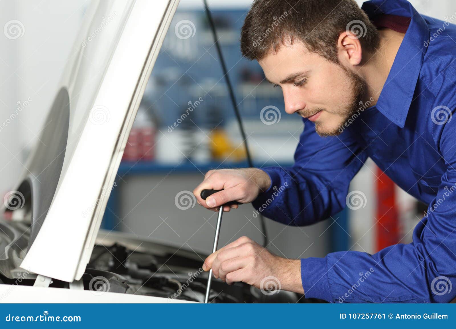 Mechanic Repairing a Car in a Workshop Stock Image - Image of hand ...