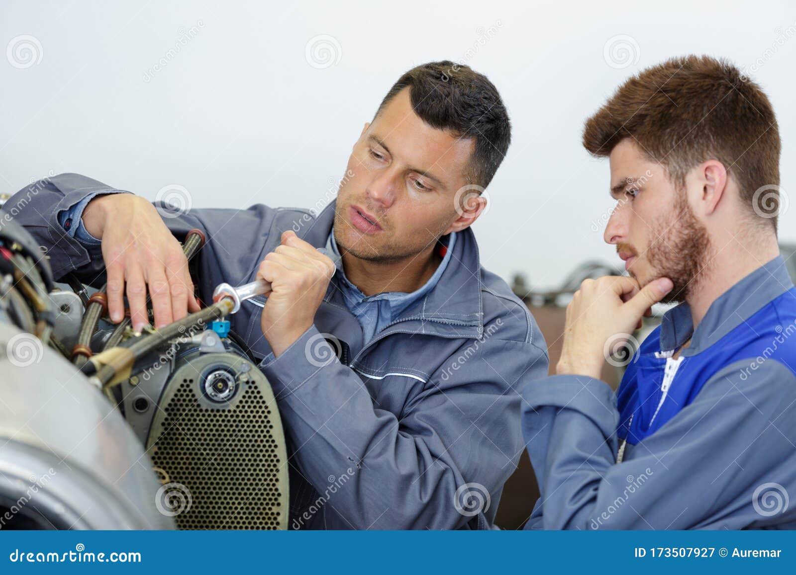 Young Mechanic Watching How To Fit Hose Stock Image - Image of mechanic ...