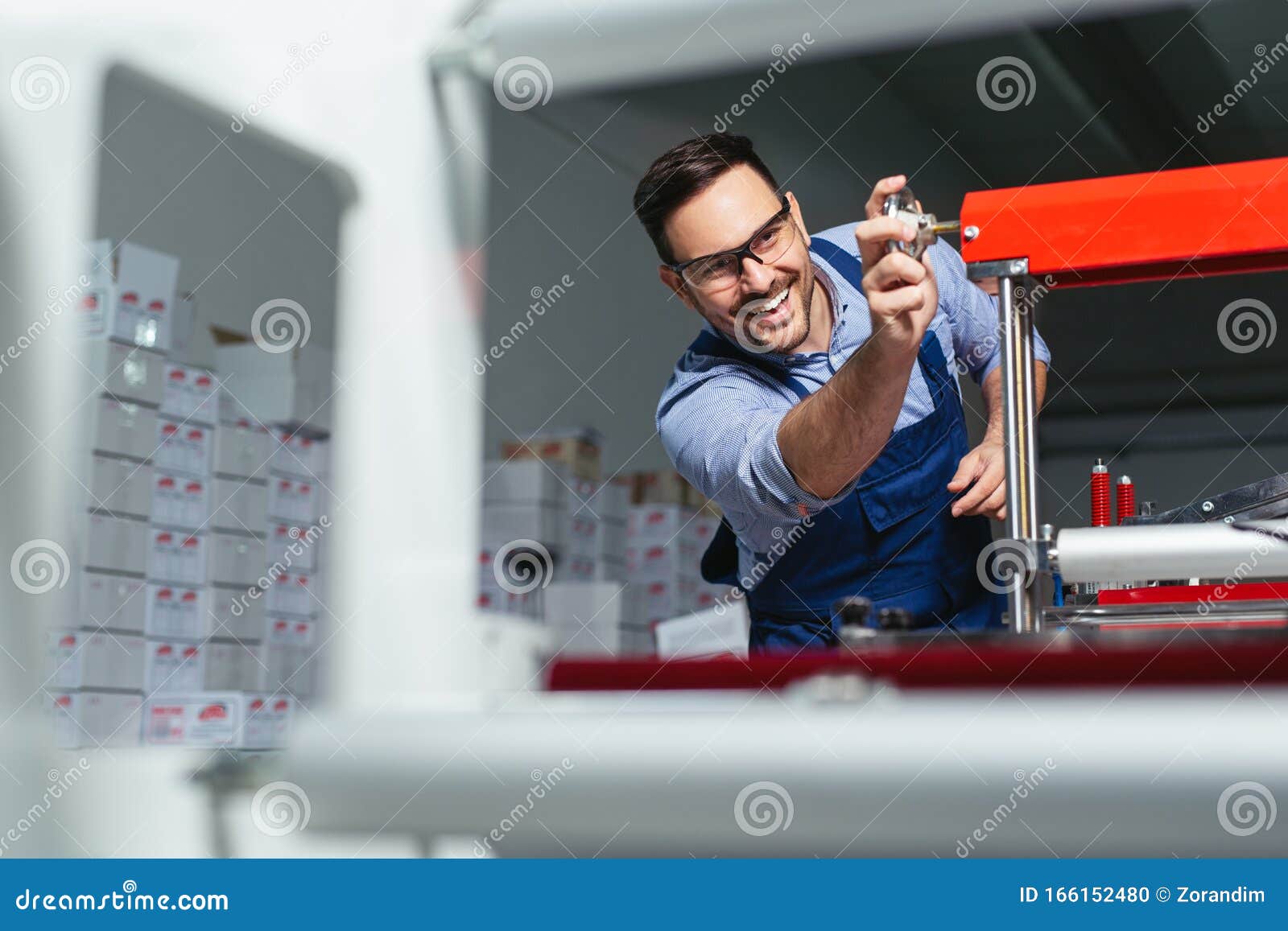 Mechanical Engineer Working on Machines. Stock Photo - Image of people ...