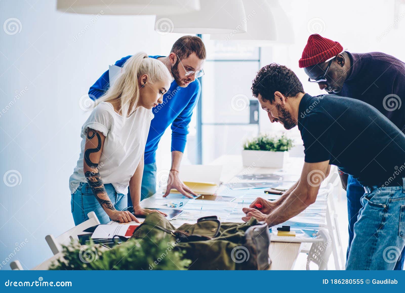 Cheerful Group of Multicultural Students Searching Right Route on Map ...