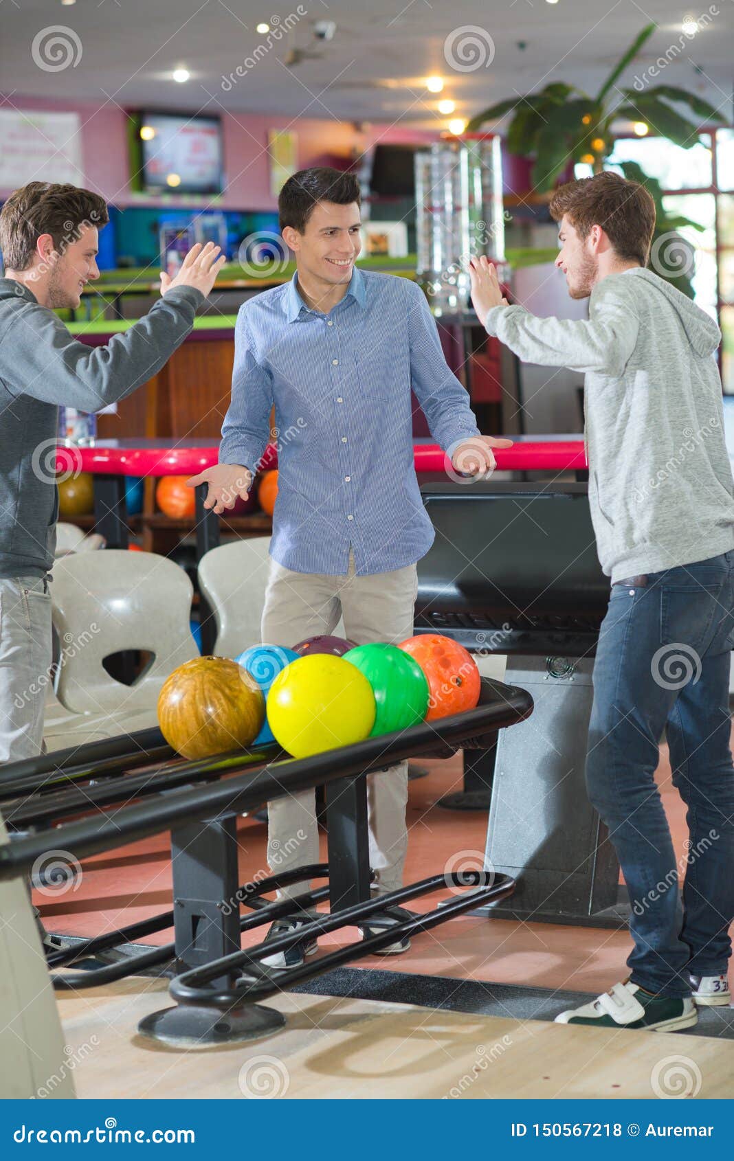 Young Men Bowling Poised To High Five Stock Photo - Image of victory ...