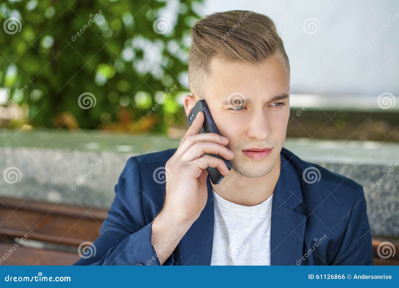 Young men calling by phone stock photo. Image of face - 61126866