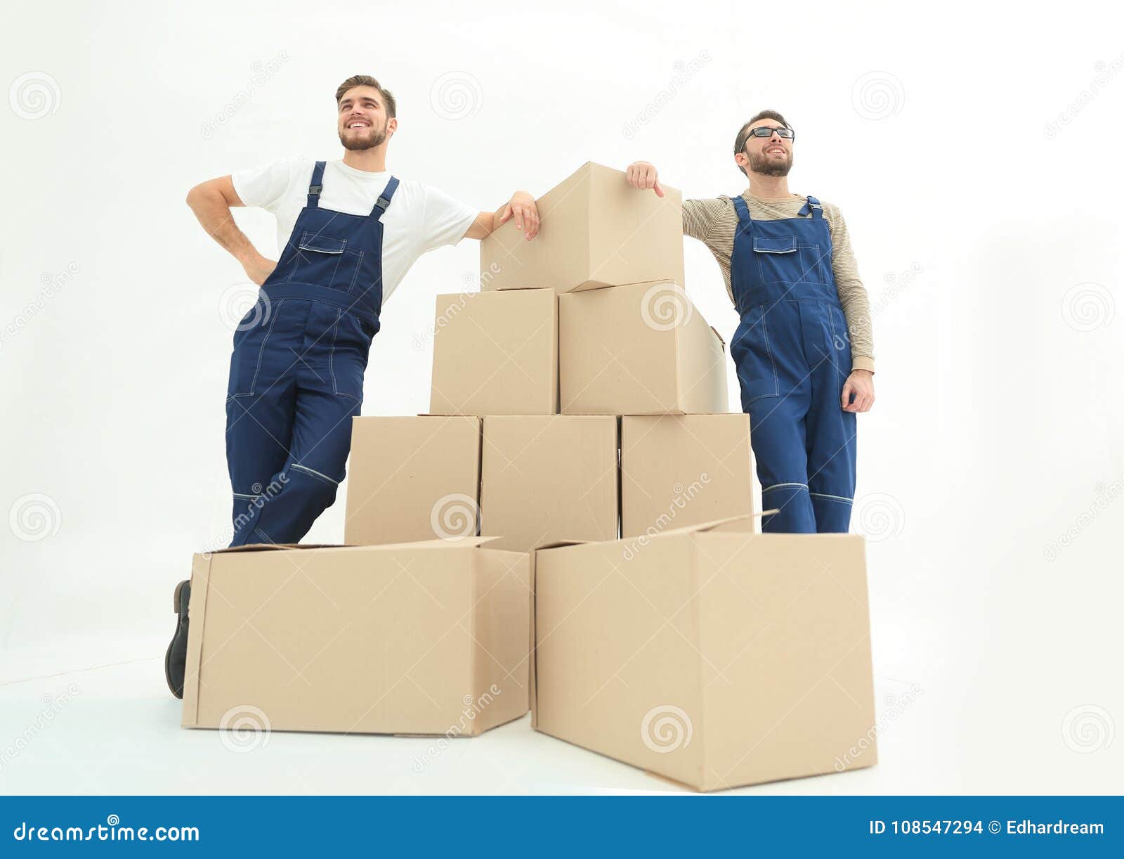 Young Men Carrying a Box To the Pile of Boxes. Stock Photo - Image of ...