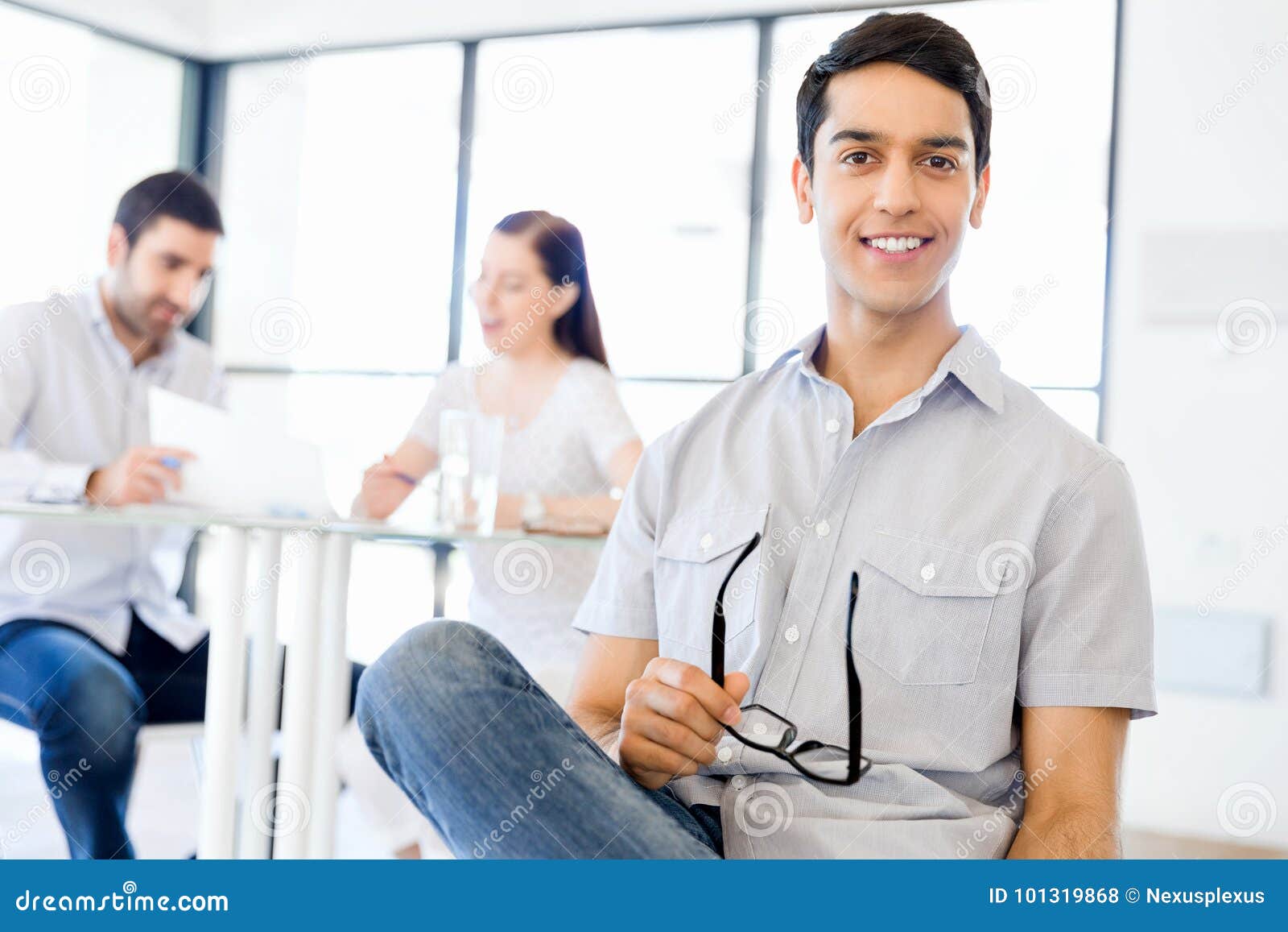 Young Man in Casual in Office Stock Photo - Image of document ...