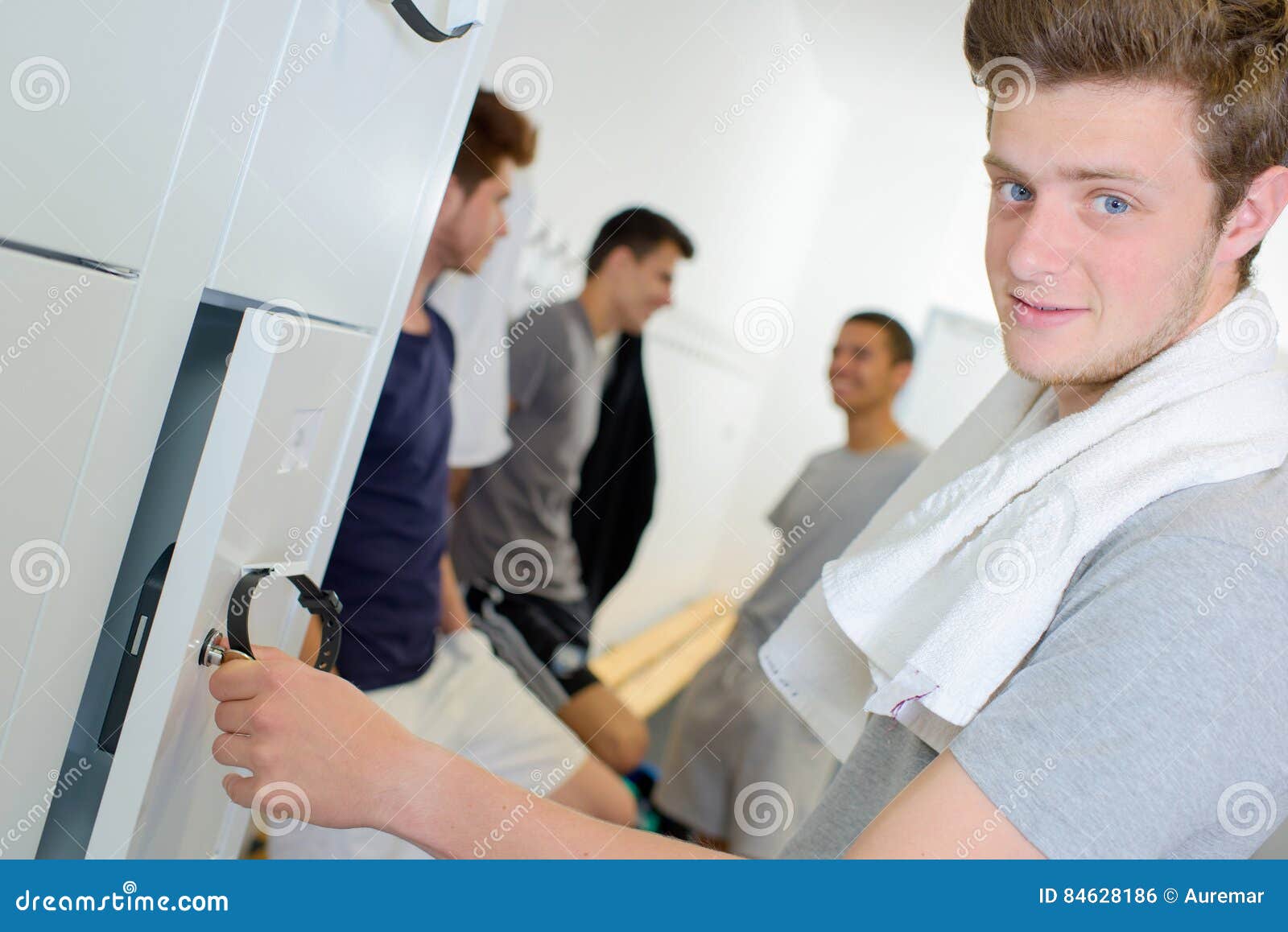 Young men in changing room stock photo. Image of towel - 84628186