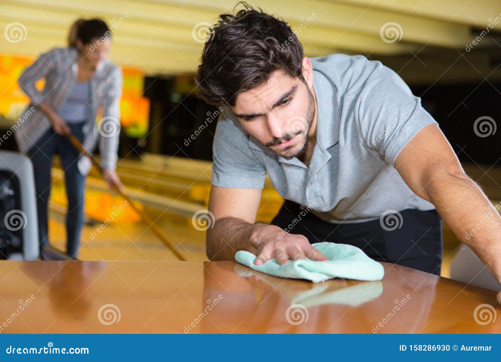 Young Man Cleaning Table at Cafe Stock Photo - Image of cafe, empty ...