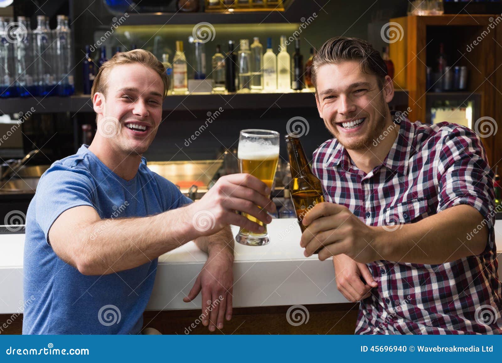 Young Men Drinking Beer Together Stock Photo - Image of caucasian ...