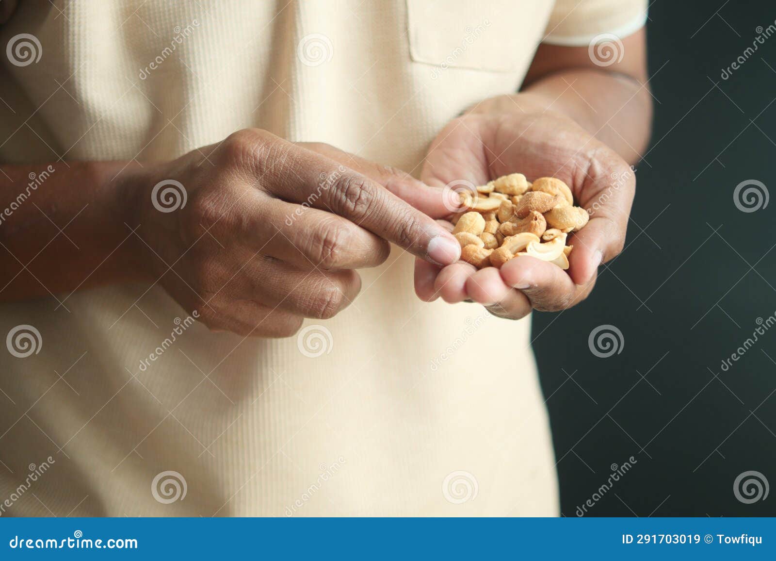 Young Men Eating Cashew Nuts Stock Image - Image of closeup, healthy ...