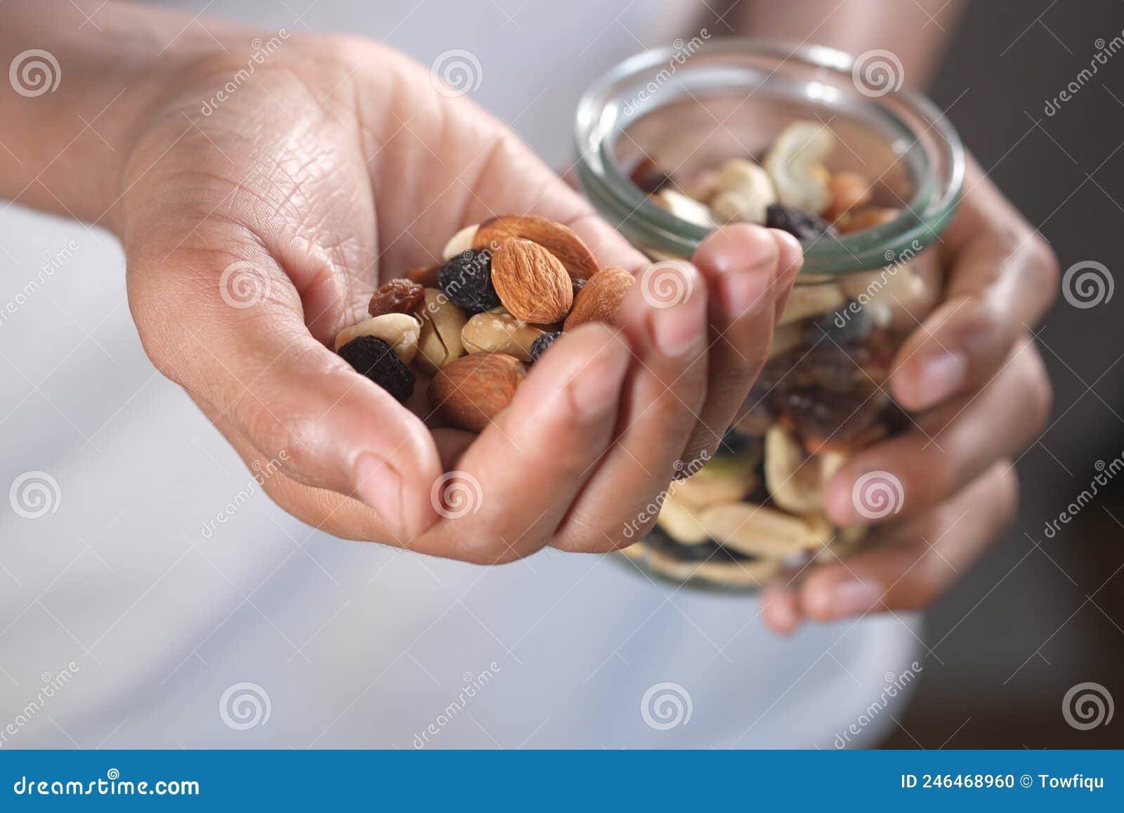 Young men eating mixed nut stock photo. Image of ingredient - 246468960