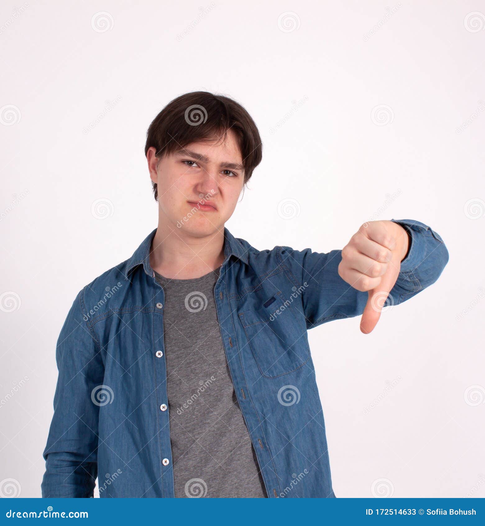 Young Men Expressing Disgust and Showing Thumb Down Sign Stock Image ...