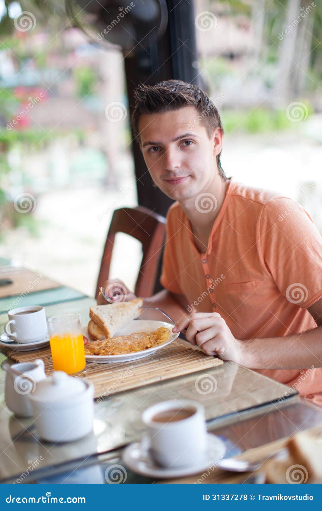Young Men Having Breakfast at Resort Restaurant Stock Photo - Image of ...