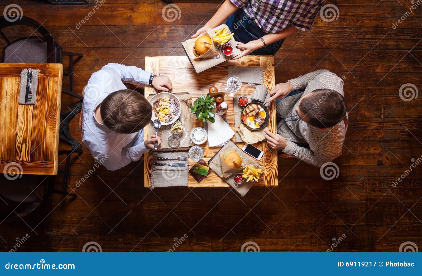 Young Men Having Lunch at a Cafe Stock Image - Image of business ...