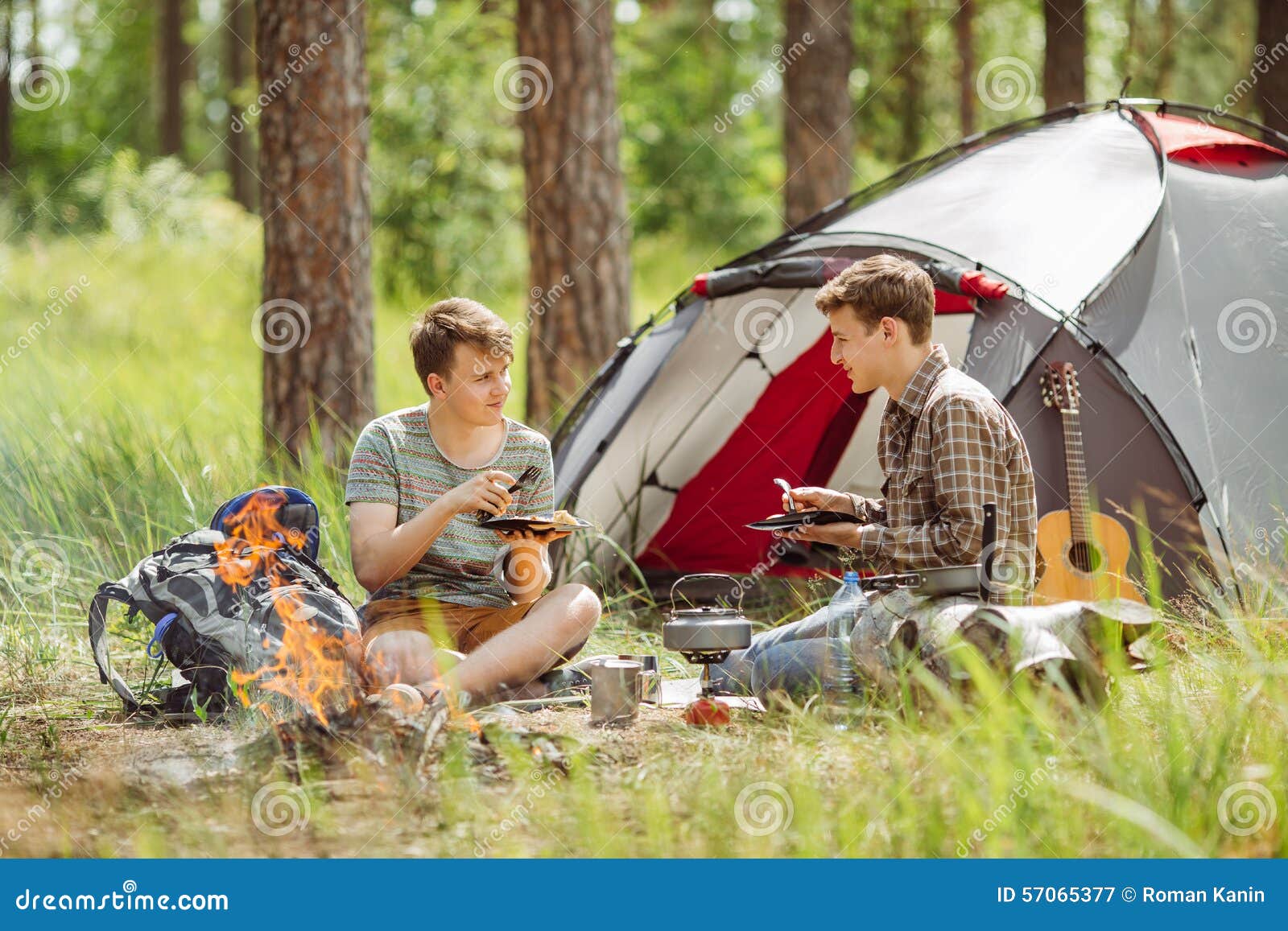Young Men are Heated in a Fire and Cook Out on a Summer Camp Stock ...