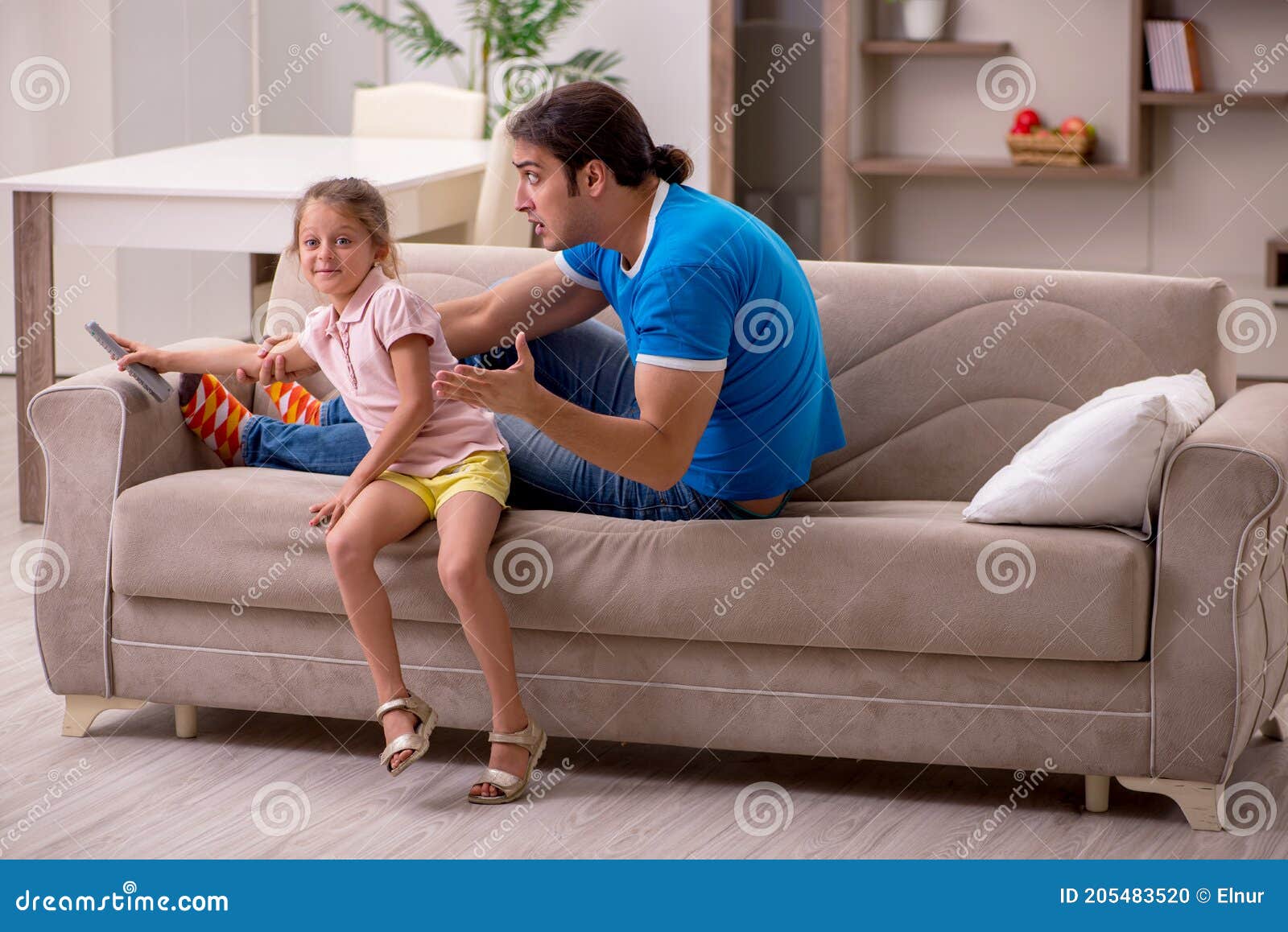 Young Man with His Daughter at Home Stock Photo - Image of cute, parent ...