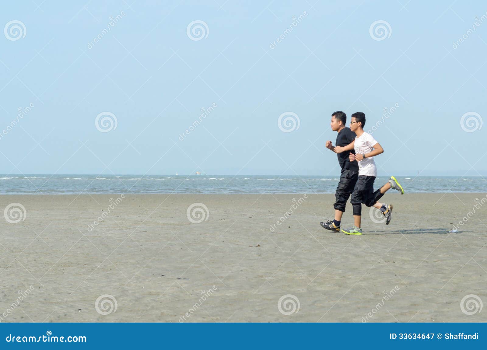 Young Men Jogging on the Beach Stock Image - Image of calm, training ...