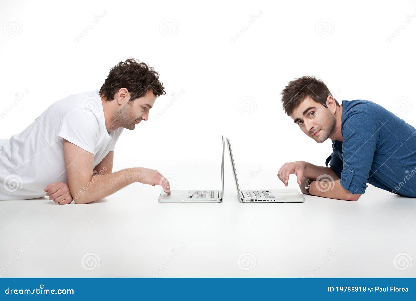 Young Men Looking at Laptops Stock Photo - Image of sitting, download ...